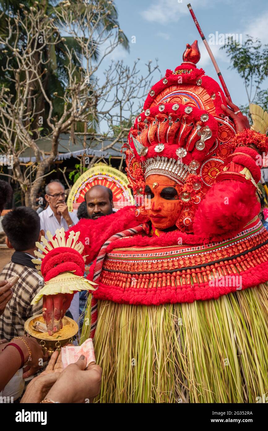 Theyyam artist perform during temple festival in Payyanur, Kerala ...