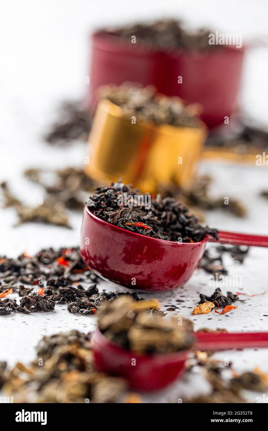 Set of different dry tea in measuring spoons Stock Photo - Alamy