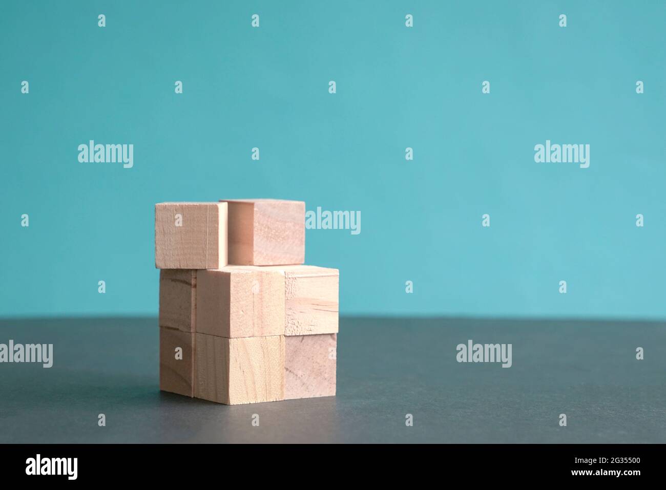 Wooden blocks on blue background. Copy space Stock Photo - Alamy