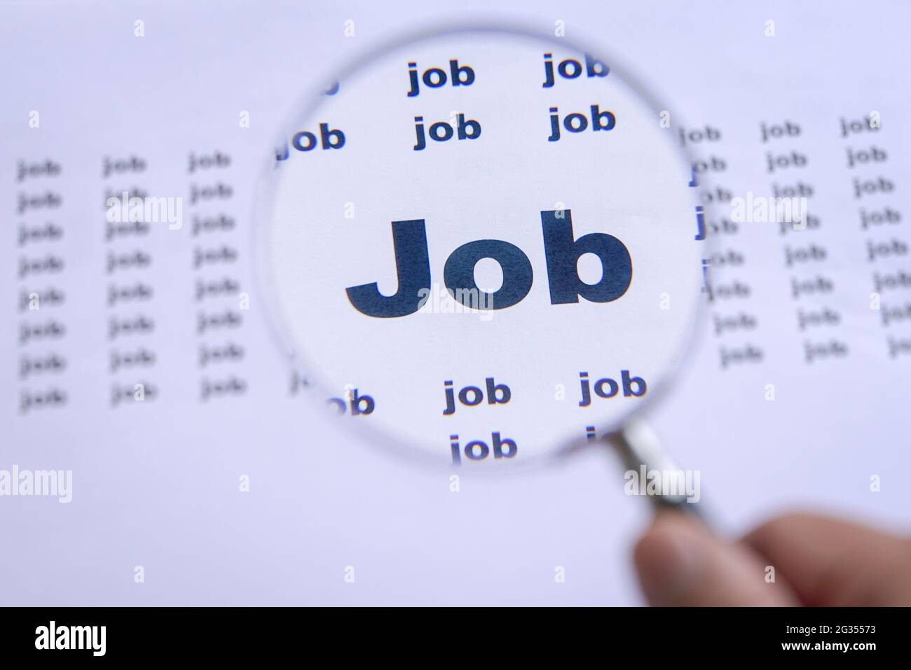 Job search concept. Magnifying glass over Job text on paper Stock Photo ...