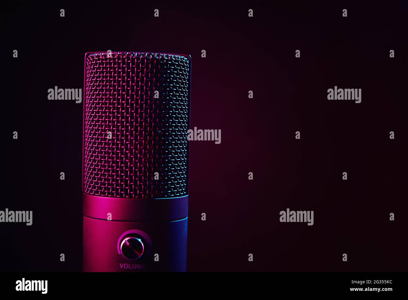 Studio microphone on dark background with copy space. Black ...