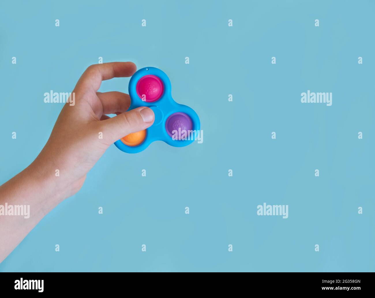 Children's Hand Holding Silicone Toy Spinner Simple Dimple Stock Photo ...