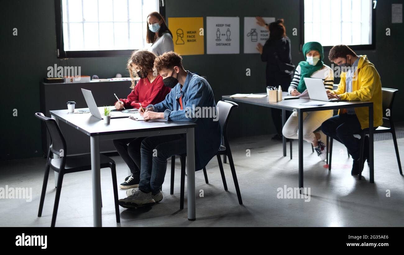 Group of people attending education class in community center ...