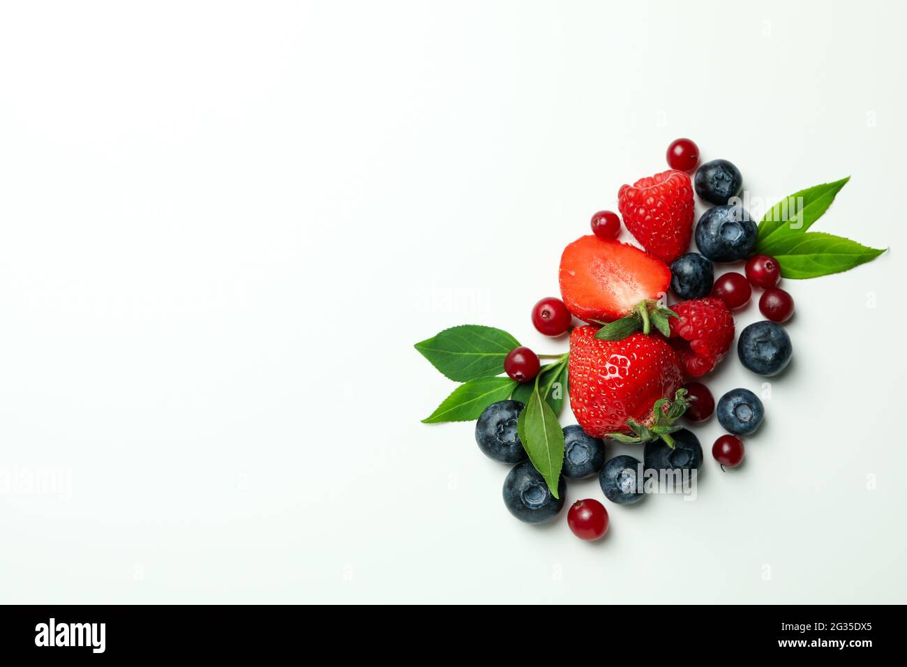 Delicious fresh berry mix on white background Stock Photo - Alamy