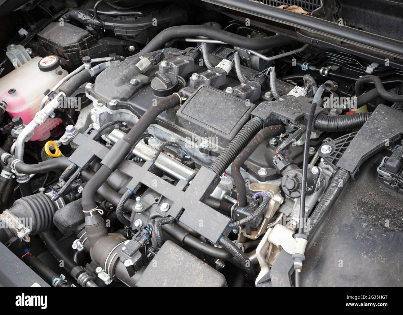 Close up detail of a modern car dirty petrol engine bay Stock Photo - Alamy