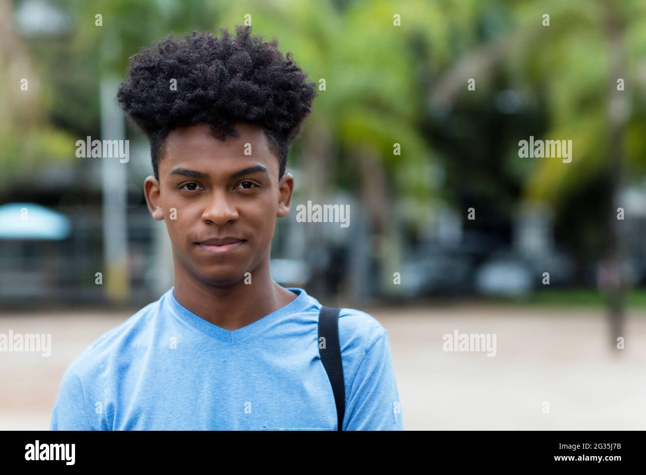 Serious black man from Brazil in city in summer Stock Photo - Alamy