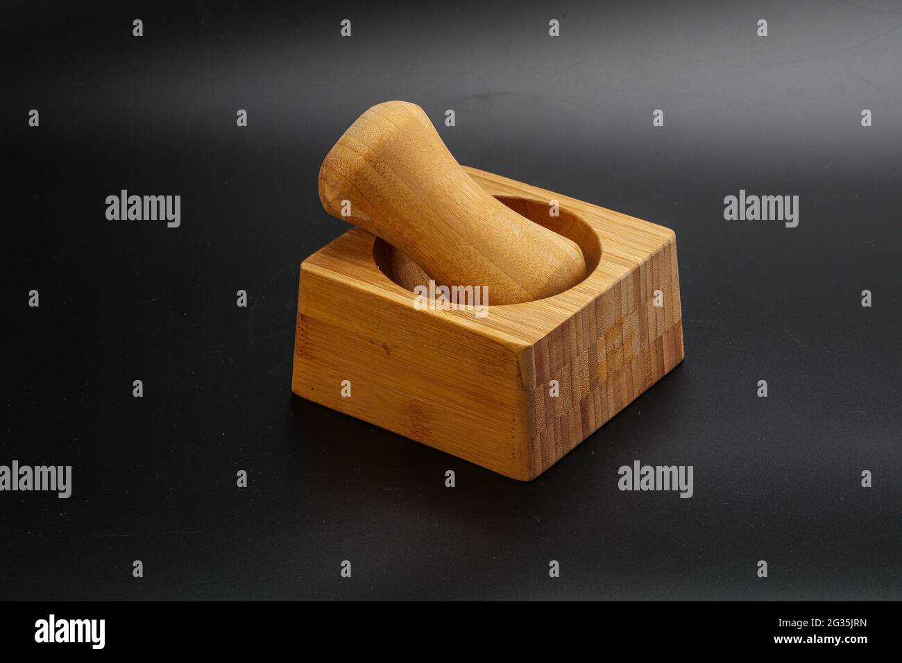 Wooden mortar for kitchen isolated over background Stock Photo - Alamy