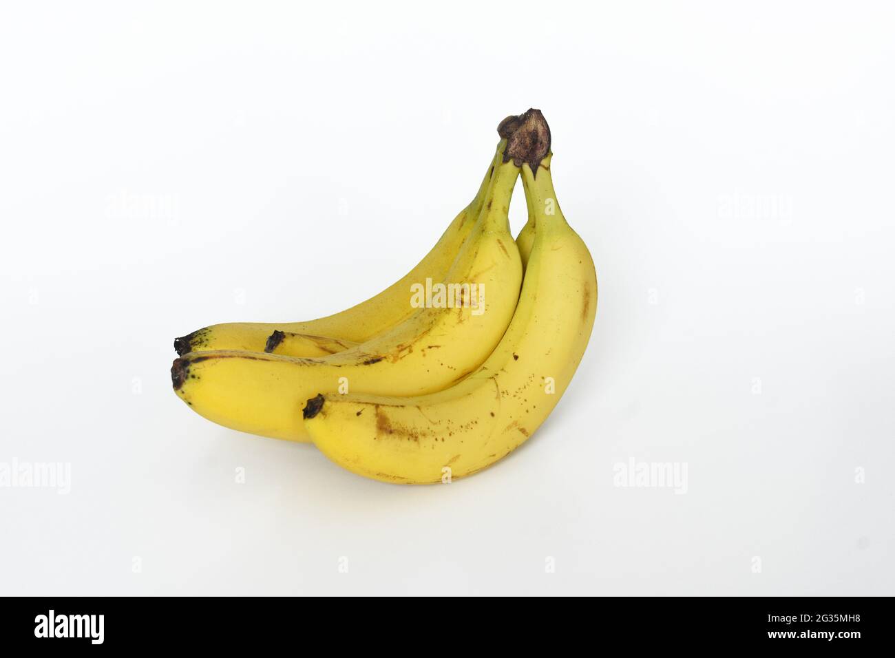 Yellow ripe bananas on isolated white background Stock Photo - Alamy