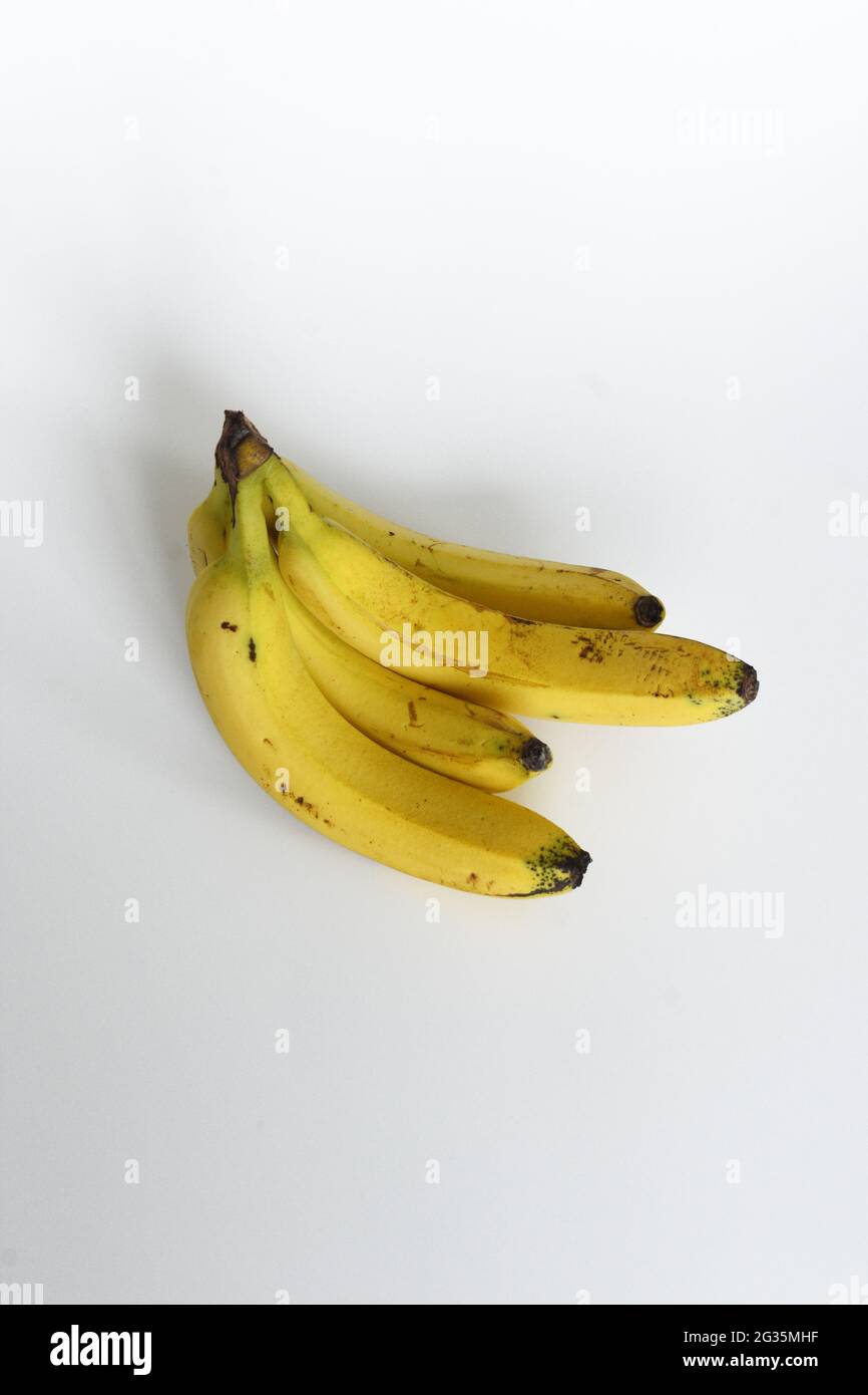 Yellow ripe bananas on isolated white background Stock Photo - Alamy