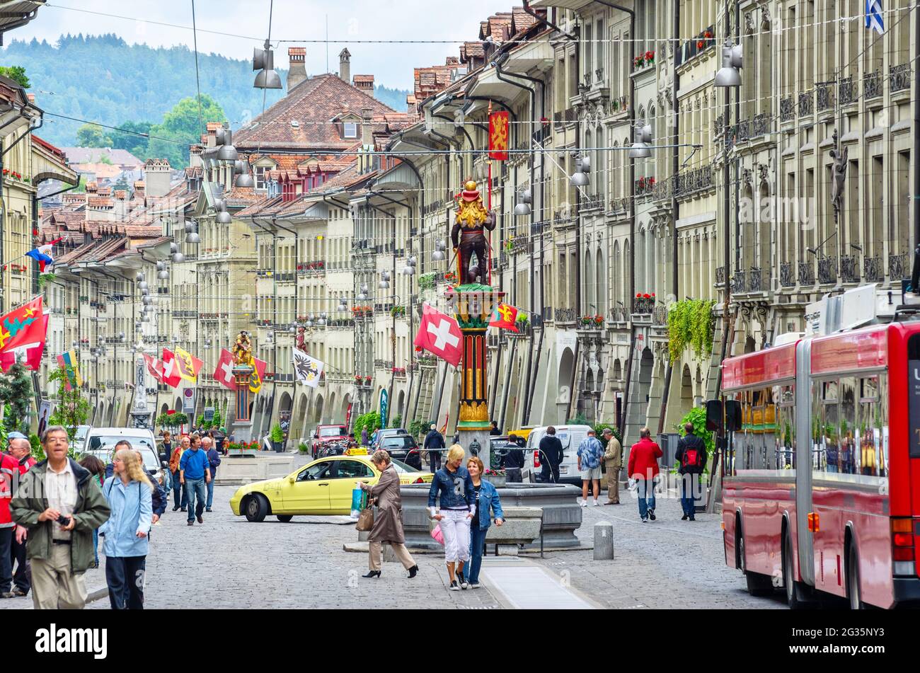 People walking at Marktgasse street in medieval center of Bern ...