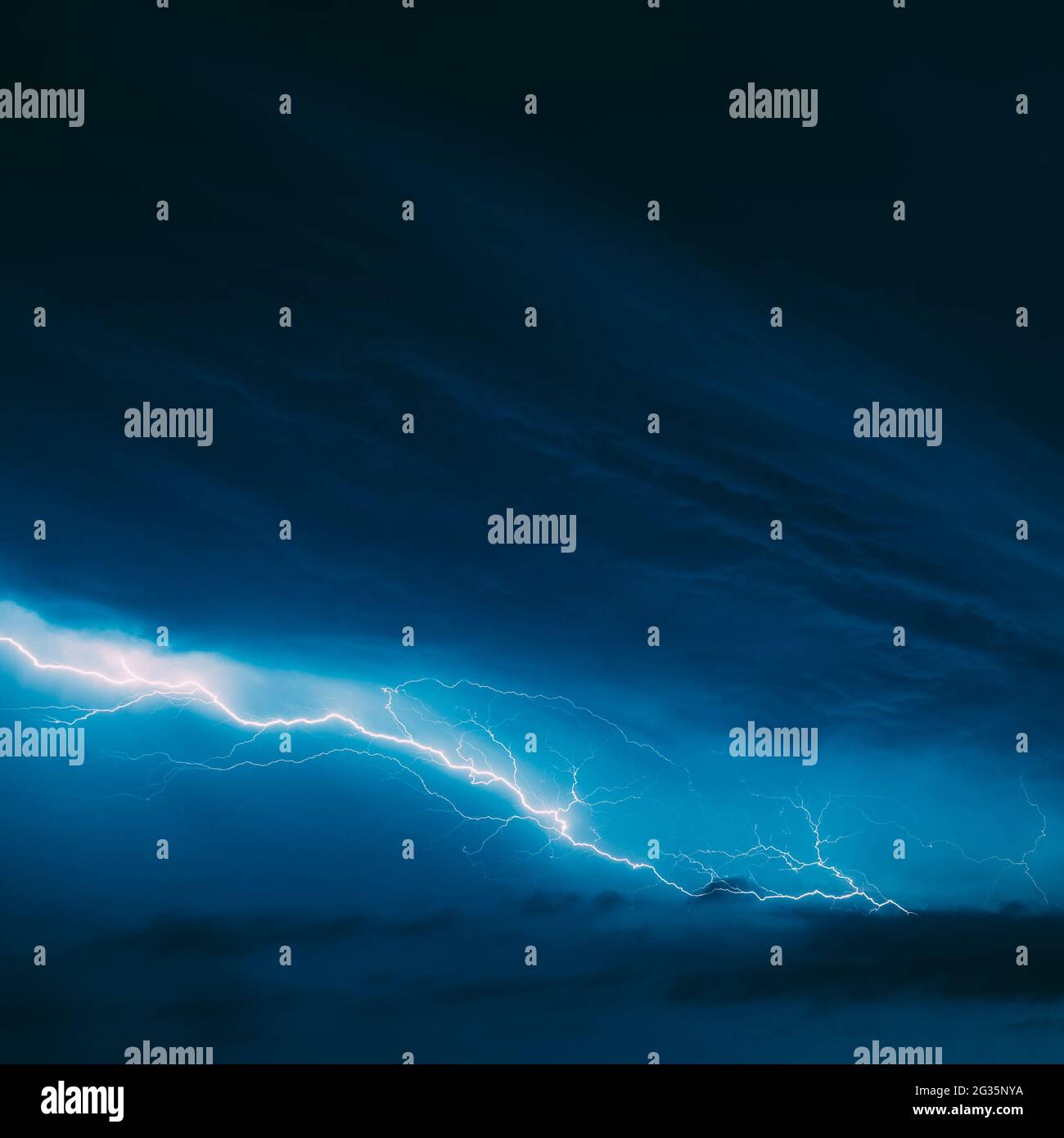 Bright Lightning On Blue Night Sky During Thunderstorm Stock Photo - Alamy