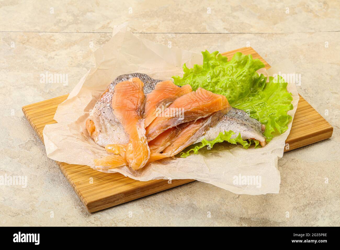 Sliced natural wild trout fillet over board Stock Photo - Alamy