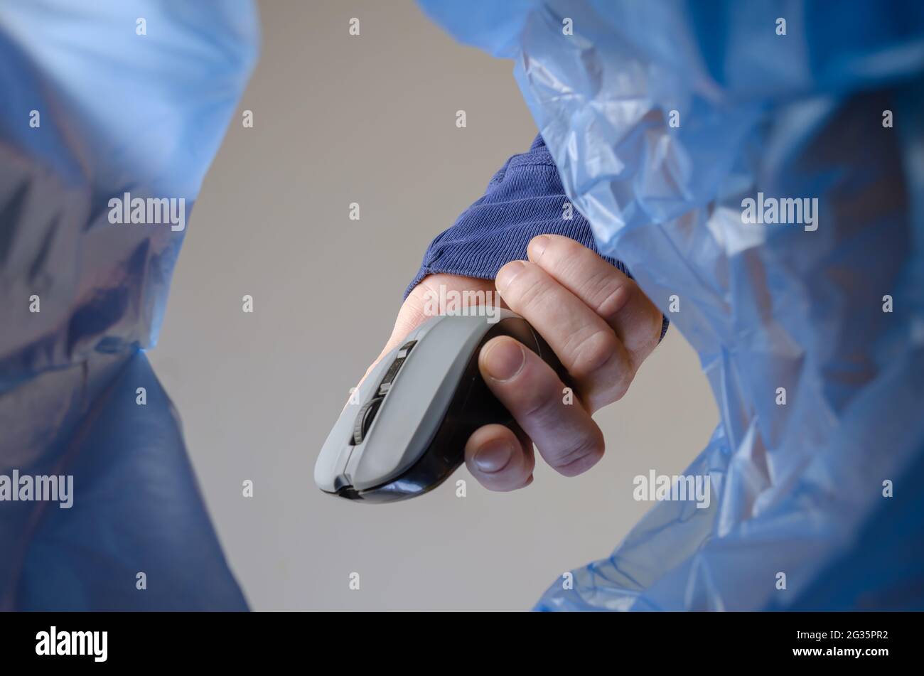 Hand tosses an wireless computer mouse into the garbage can. An adult ...