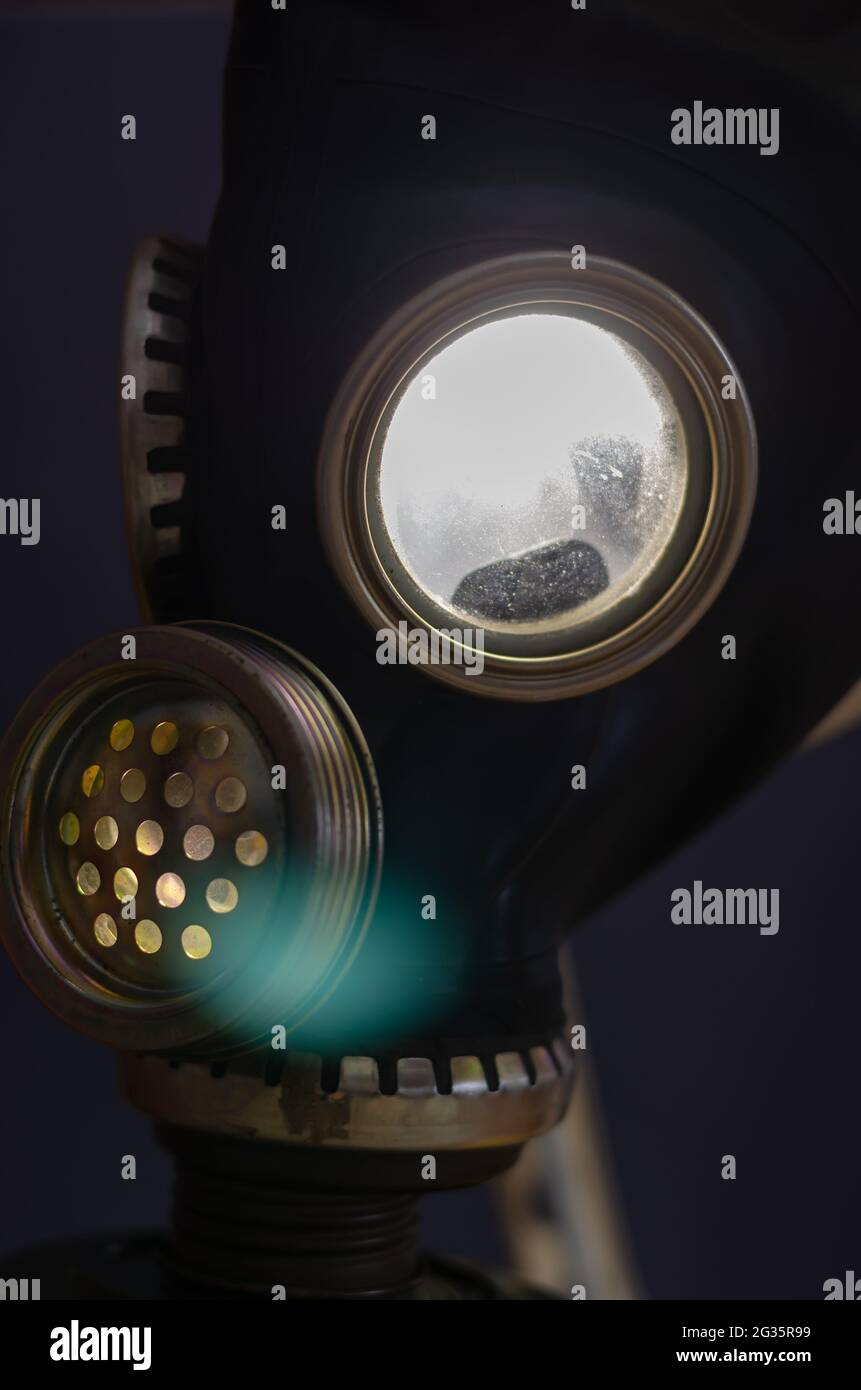 Abstract composition with a gas mask glowing from inside. Military gas ...