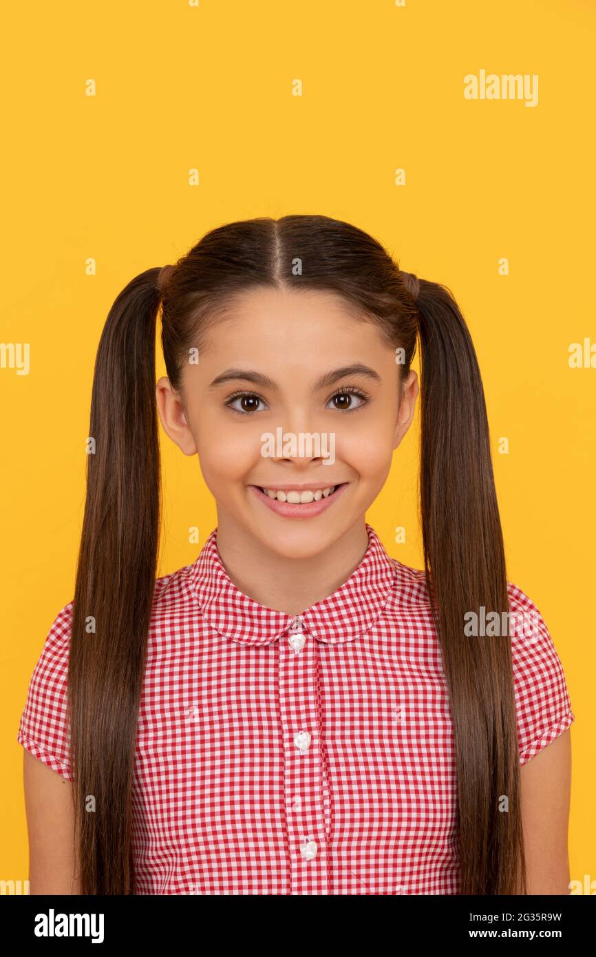 Smile lit up her face. Smiling child face. Happy girl portrait yellow ...