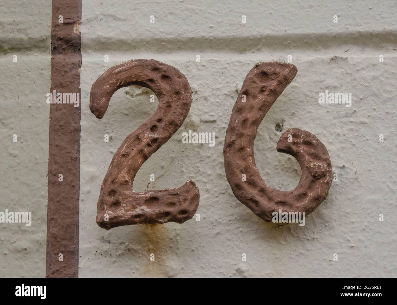 A sign on a wall with the number Stock Photo - Alamy