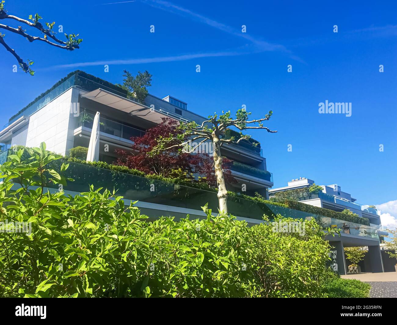 Modern apartment buildings and street in Wollerau, canton of Schwyz in ...