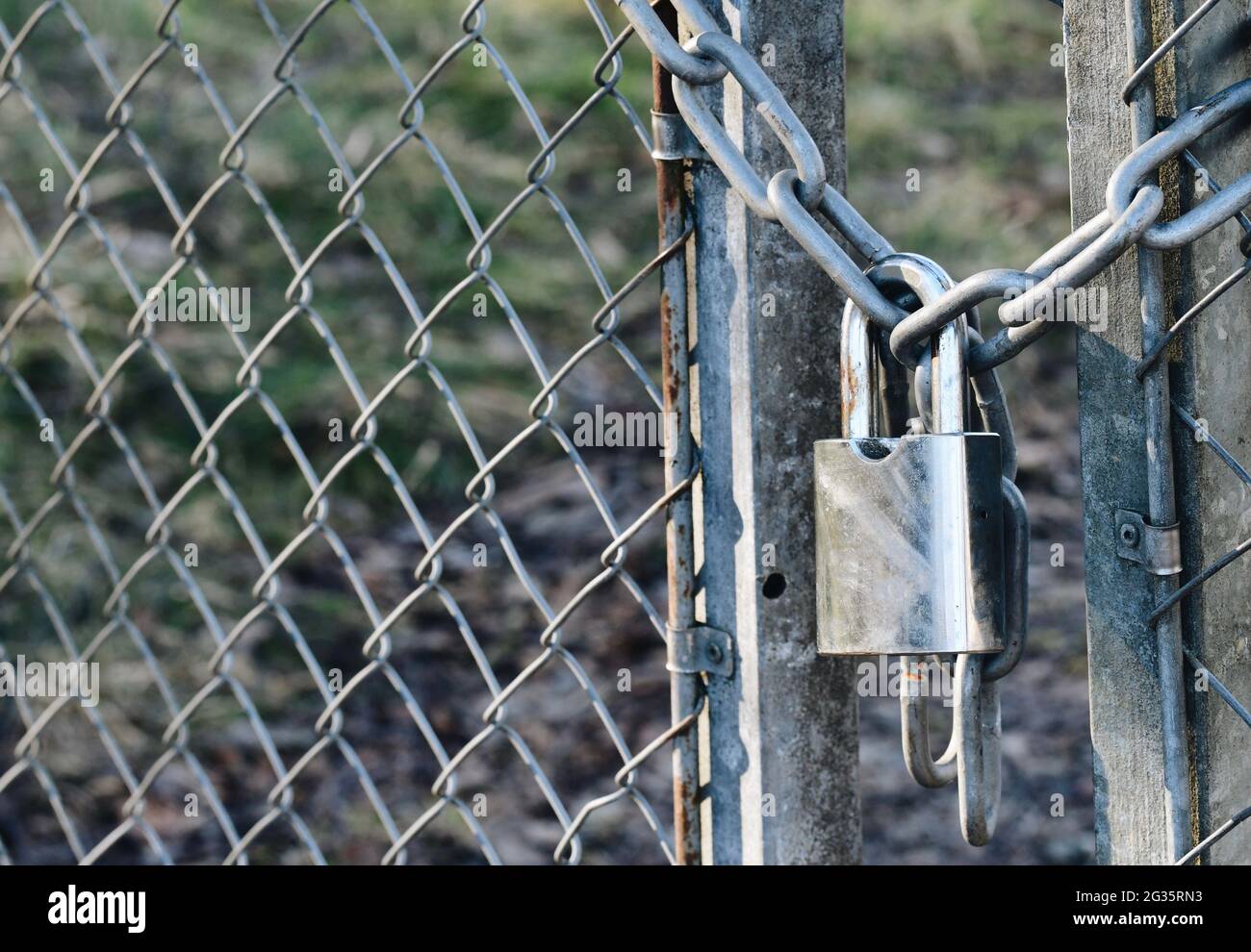 Photo of a padlock on a fence Stock Photo - Alamy