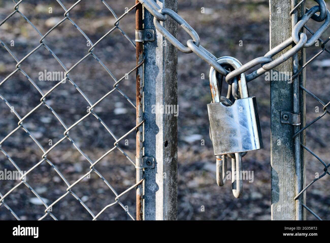 Photo of a padlock on a fence Stock Photo - Alamy