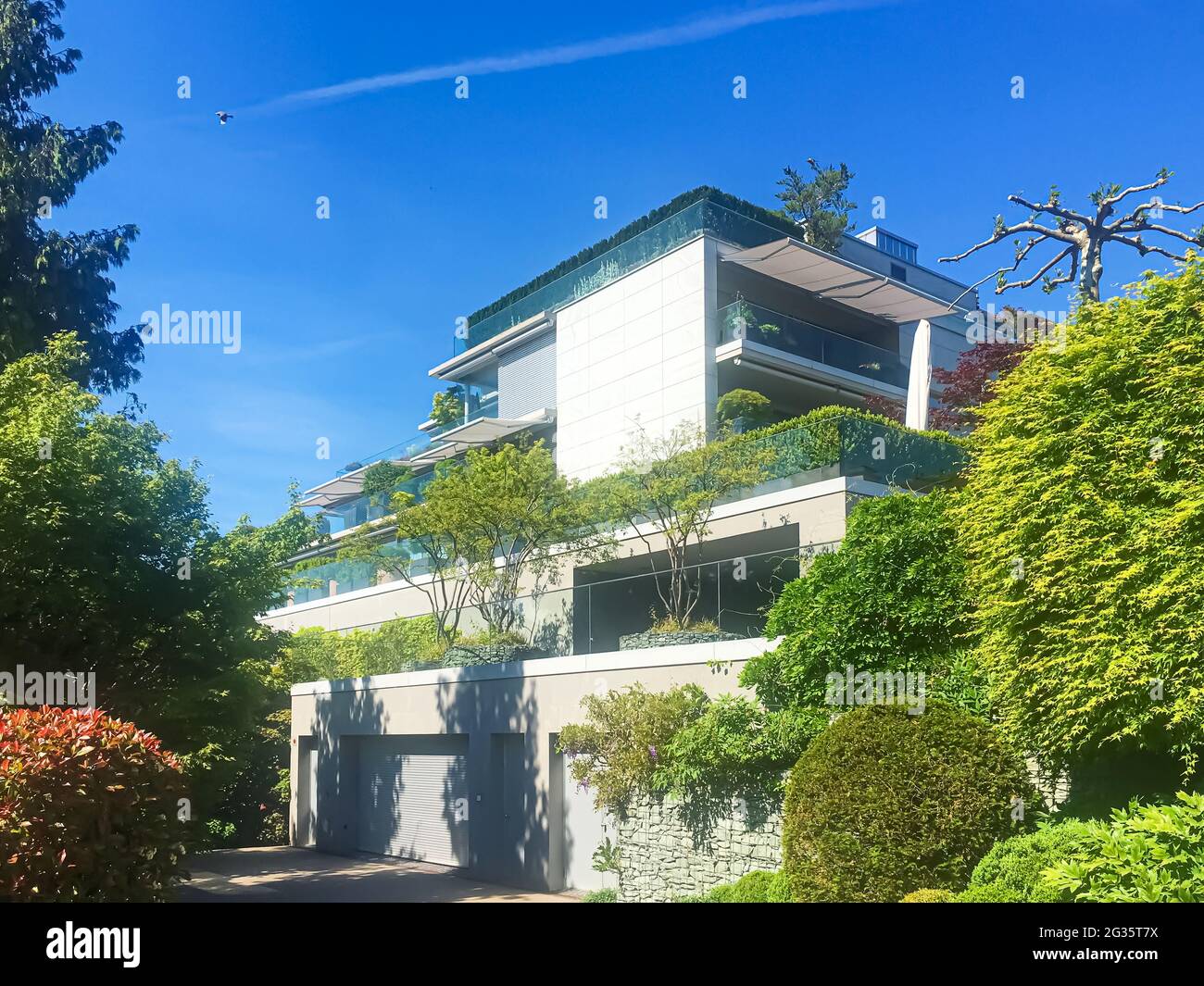 Modern apartment buildings and street in Wollerau, canton of Schwyz in ...