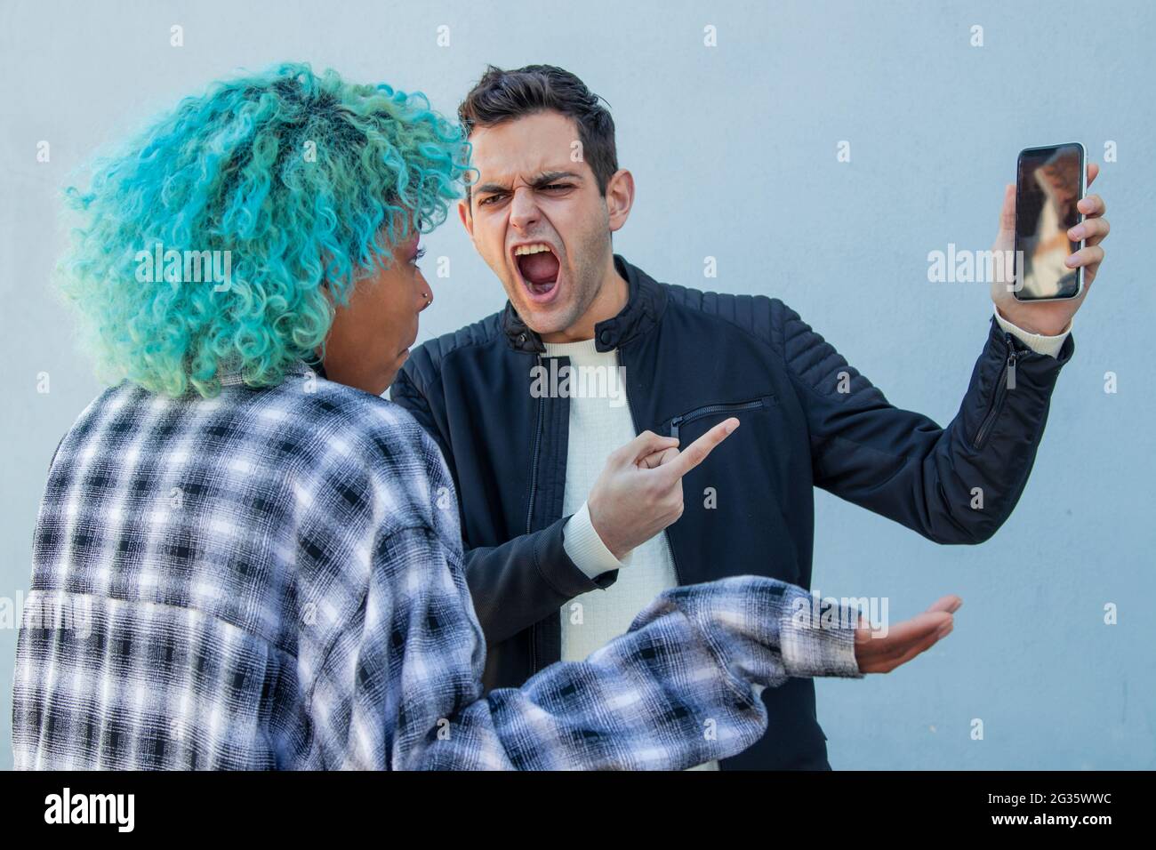 Couple on mobile phone arguing hi-res stock photography and images - Alamy