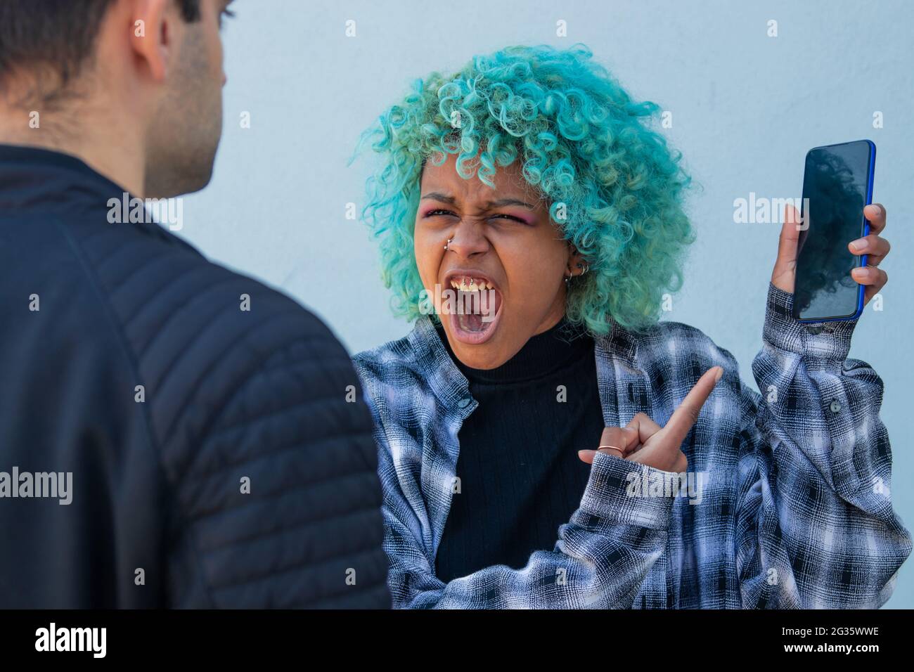 couple arguing on the mobile phone Stock Photo - Alamy