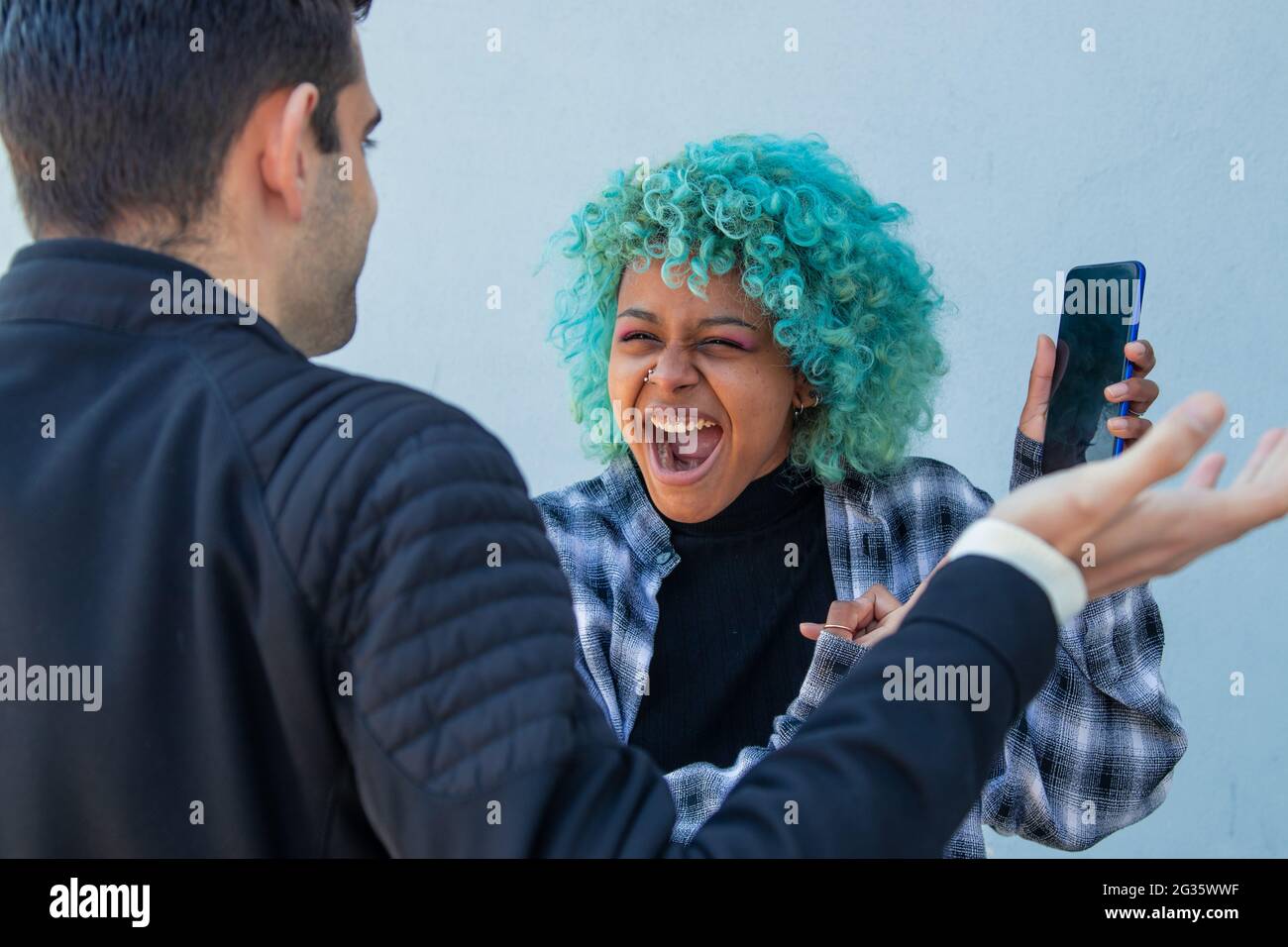 Couple on mobile phone arguing hi-res stock photography and images - Alamy