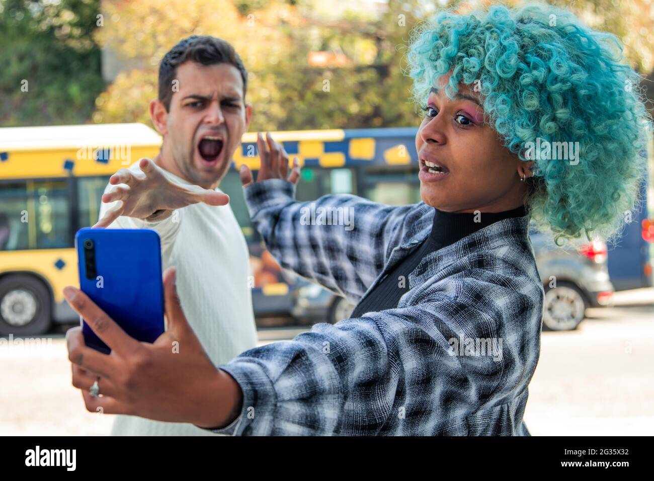 couple fighting over the mobile phone Stock Photo - Alamy