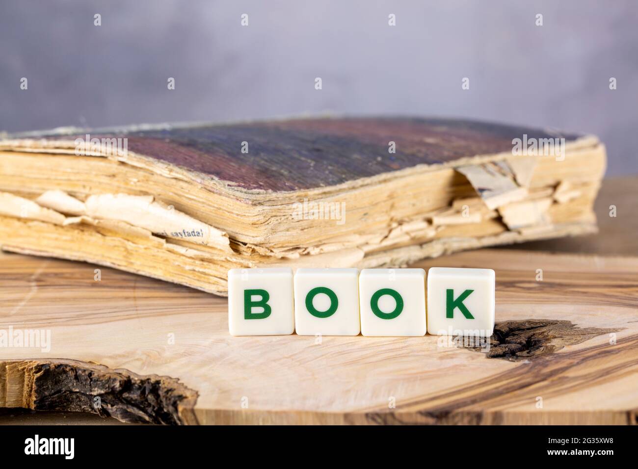 Letter cube Book in background , learning, education or hobby concept ...