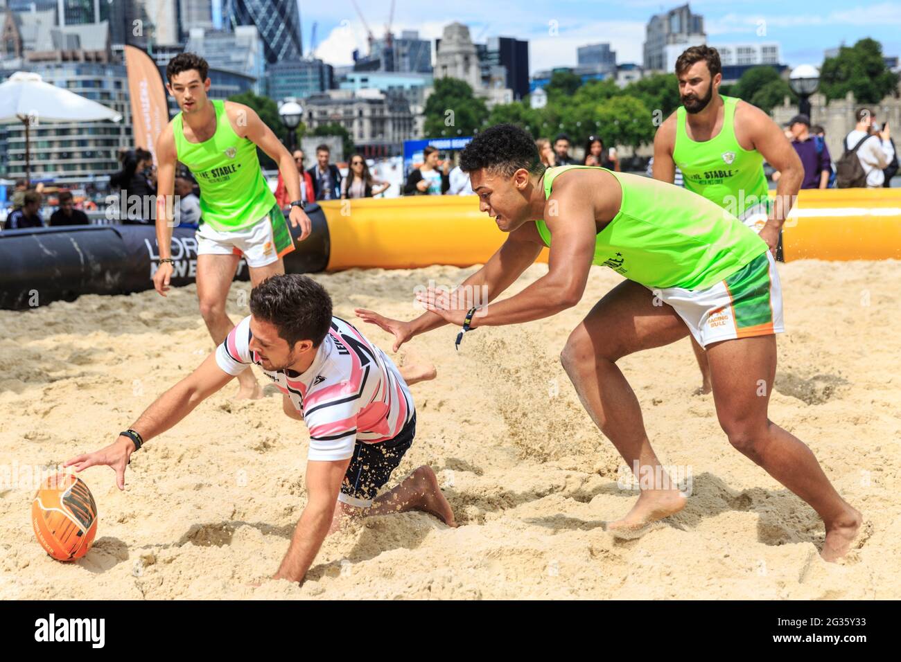 Rugby players in game at London Beach Rugby event, London, UK Stock ...