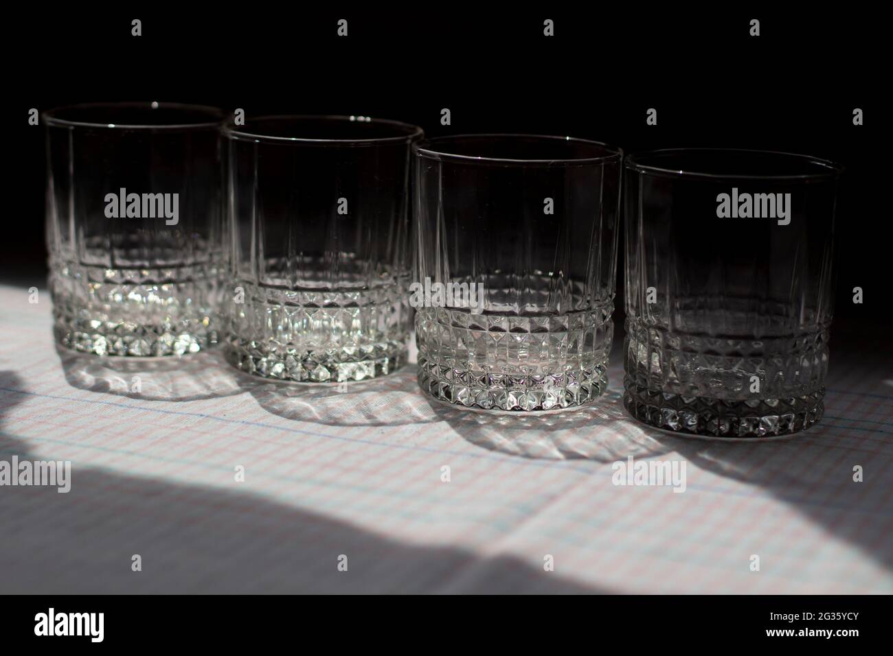 Glass beakers. Transparent glass on the table. Dishes in the kitchen ...