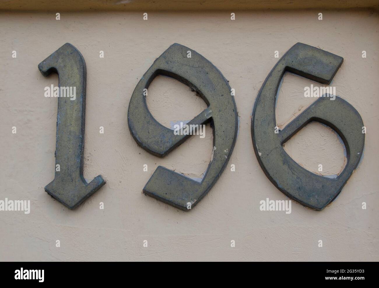 A sign on a wall with the number Stock Photo - Alamy