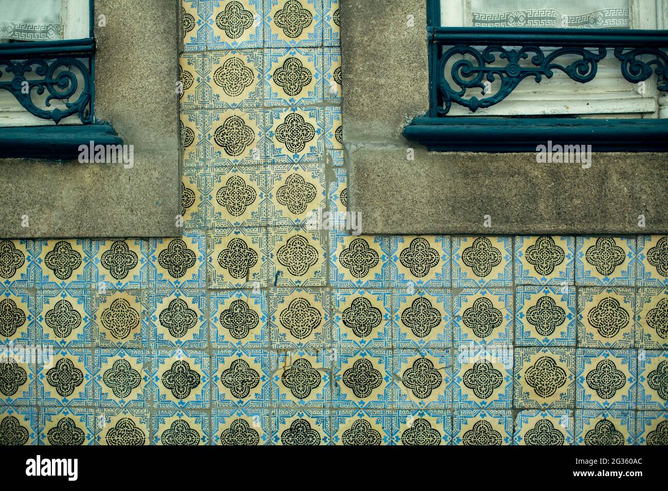 Traditional old tiles wall of the building on street painted tin-glazed ...