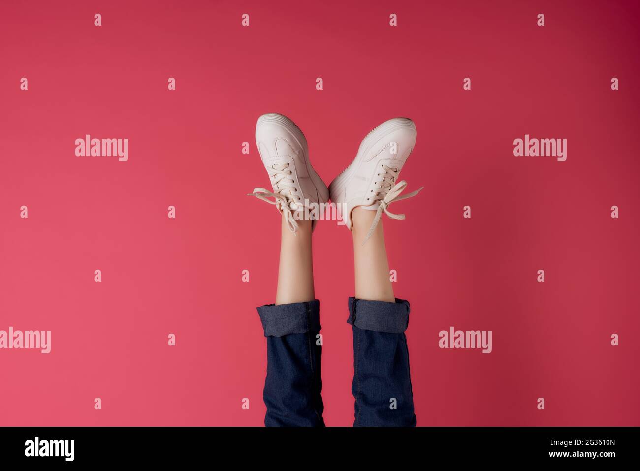 inverted female legs sneakers fashion cropped view Stock Photo - Alamy