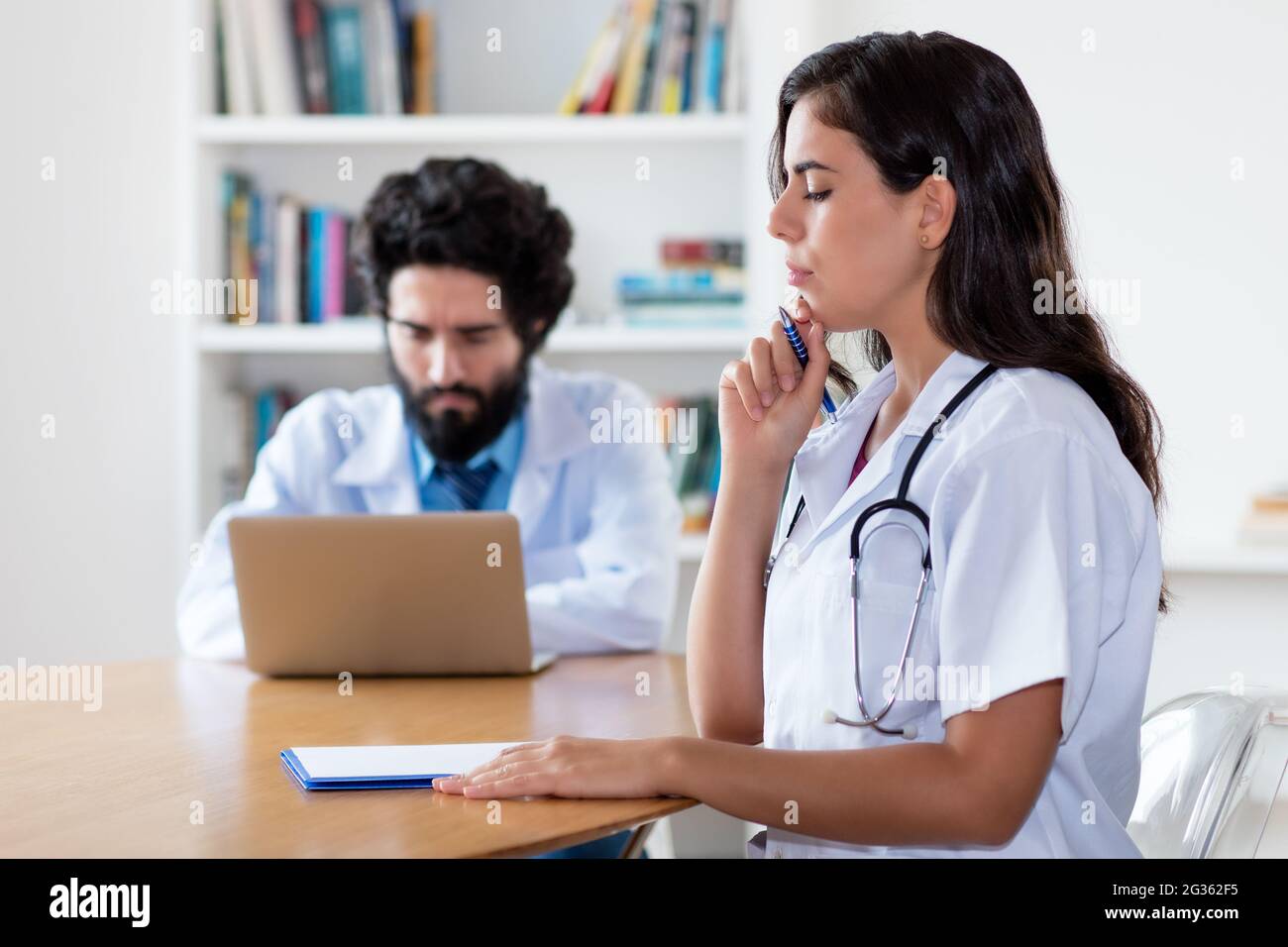 Laughing turkish medical female student with doctor at hospital Stock ...