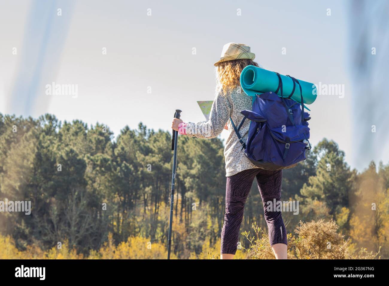 woman with backpack and map hiking Stock Photo - Alamy