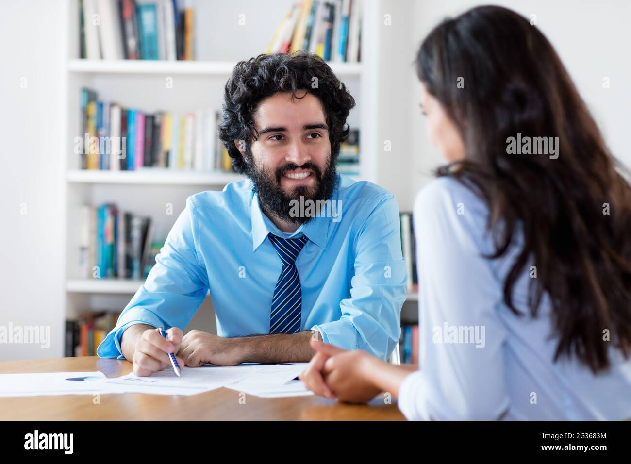 Arabic businessman at job interview with indian trainee at office Stock ...