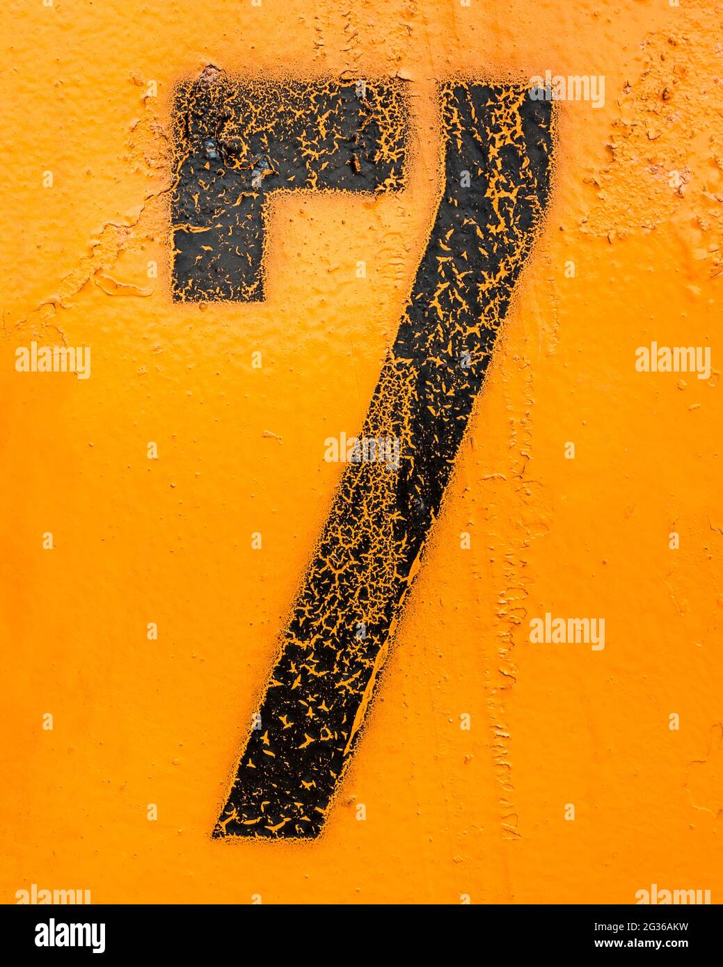 Black seven sprayed on bright orange background Stock Photo - Alamy