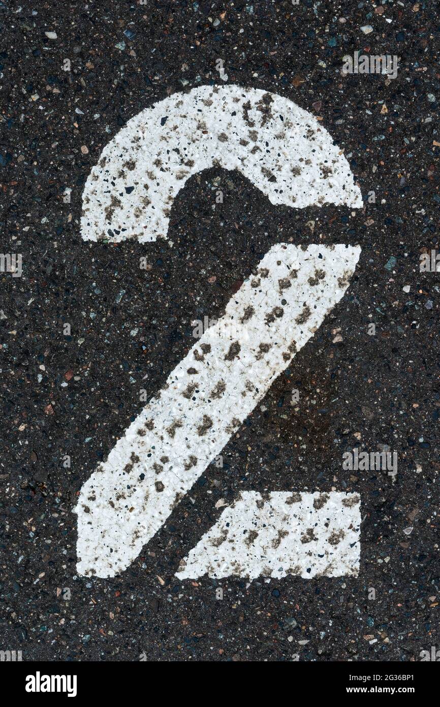 White number 2 painted on tar Stock Photo - Alamy