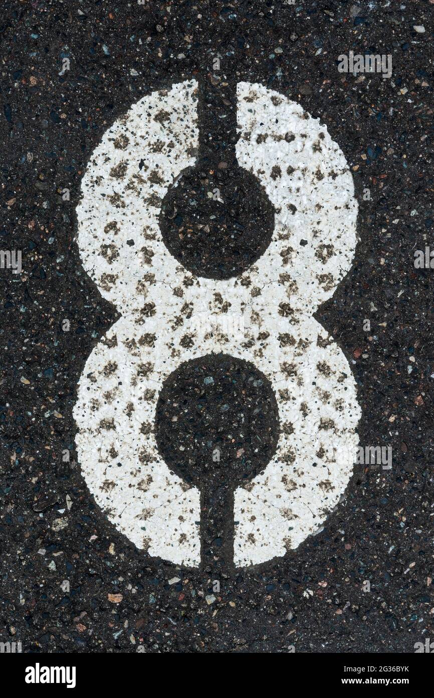 White number 8 painted on tar Stock Photo - Alamy