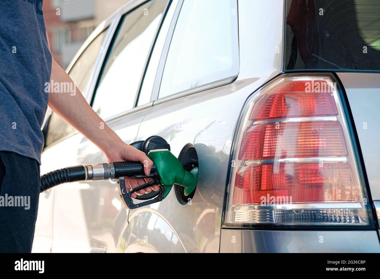 Gas station column. The driver inserted a gas station gun into the tank ...