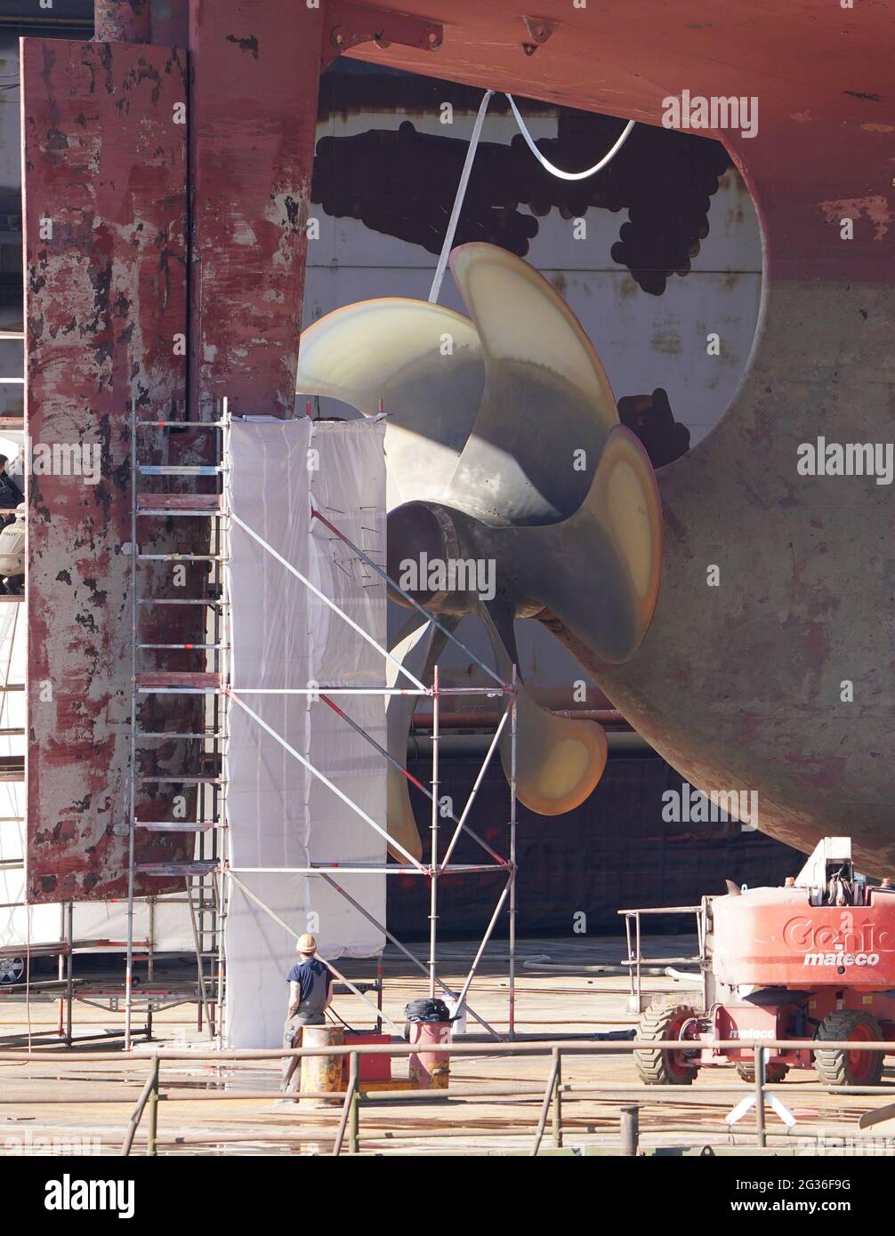 Hamburg, Germany. 14th June, 2021. Shipyard workers work on the huge ...