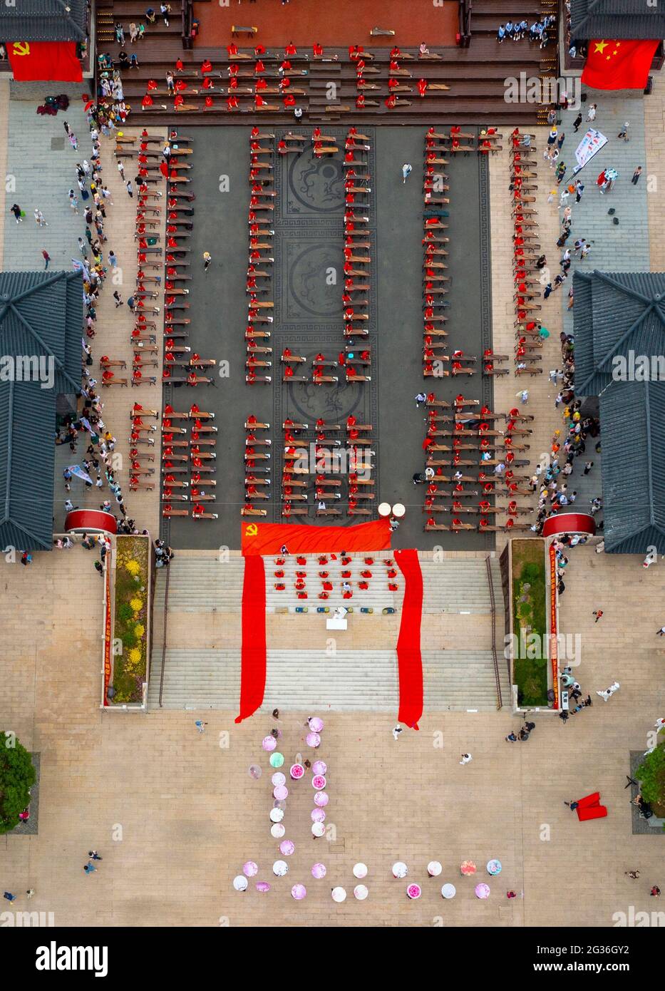 SUQIAN, CHINA - JUNE 13, 2021 - 300 teenagers dressed in red gauze play ...