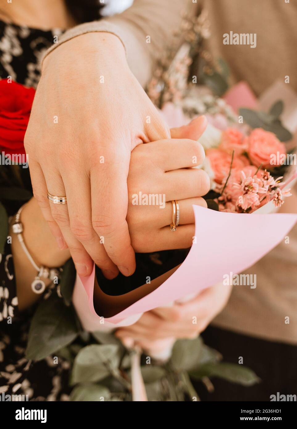 Two newlyweds holding hands hi-res stock photography and images - Alamy