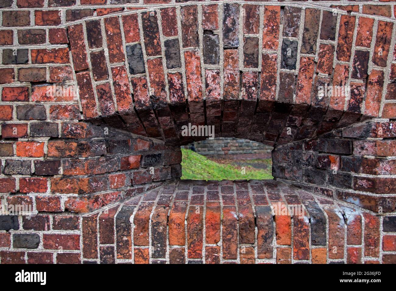 Ancient rectangular embrasure with semicircular arch with a perspective ...