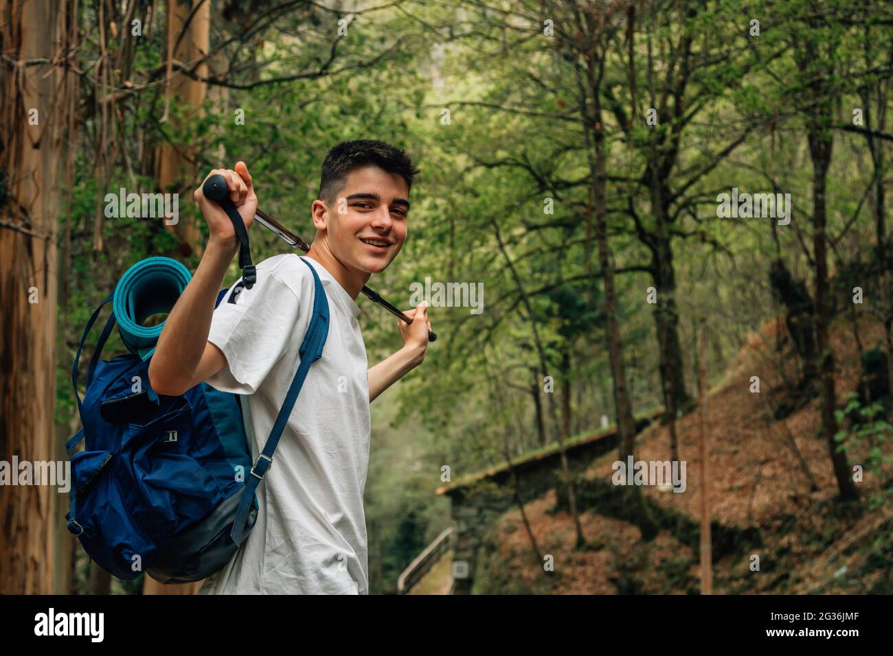 boy with backpack hiking or pilgrimage Stock Photo - Alamy