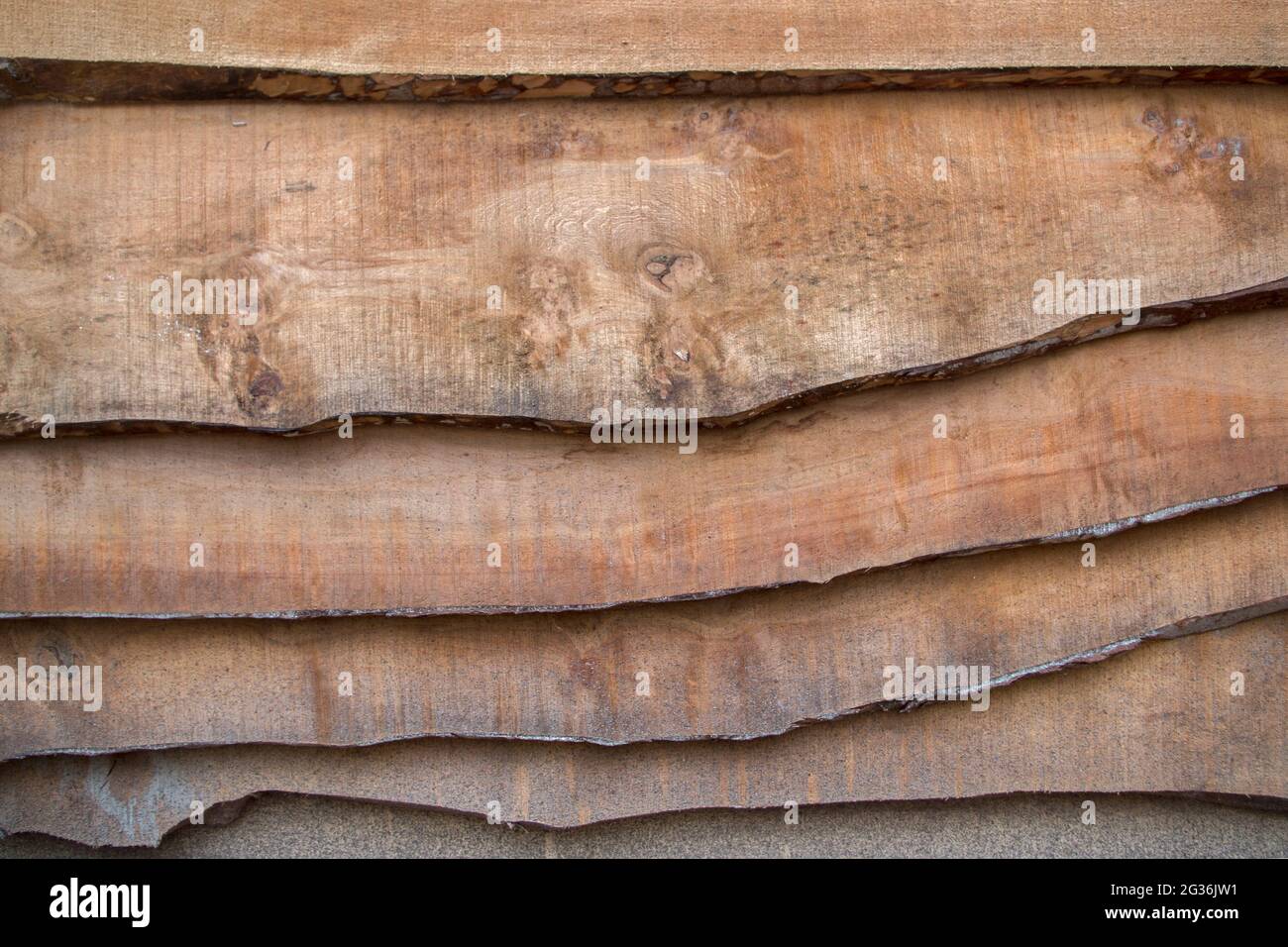 A wall or fence, faced and composed of roughly hewn horizontally laid ...