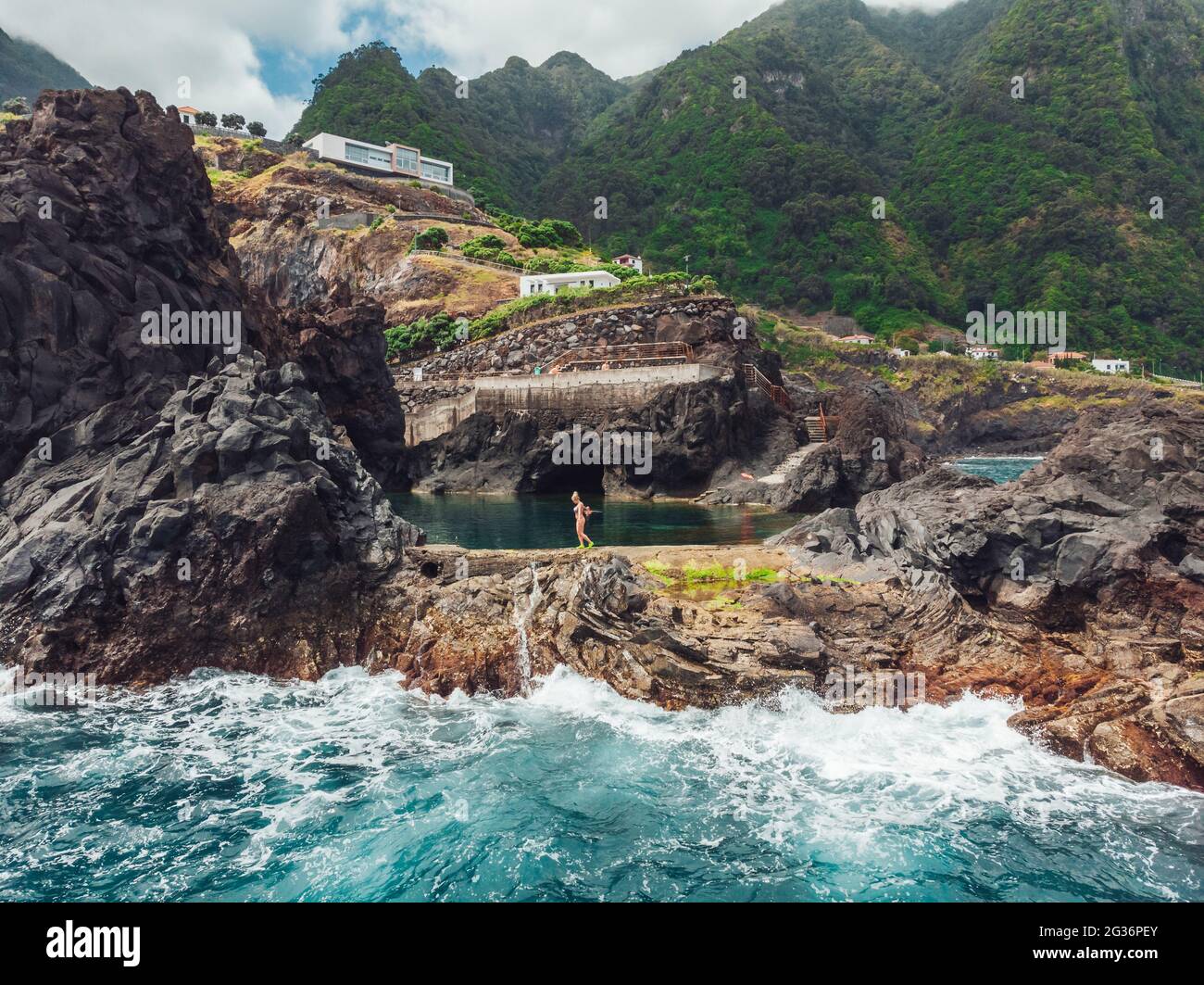 Cliffs and forested mountains on the coast of a sea Stock Photo - Alamy