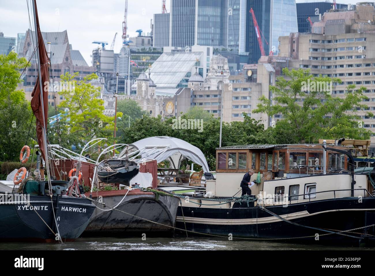 With the capital's financial district inthe background, barges and ...