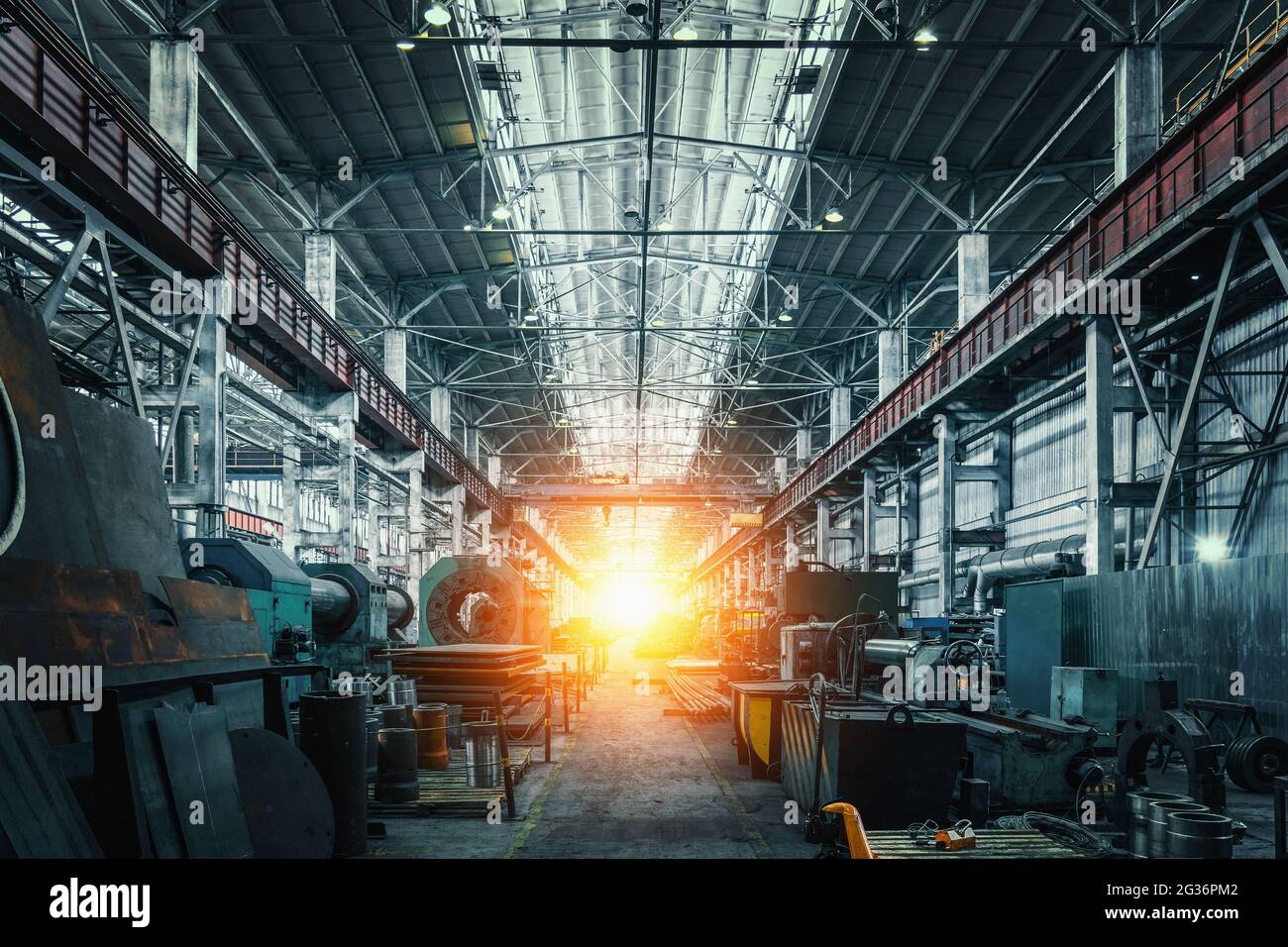 Abstract Industrial interior with light in end of workshop corridor ...